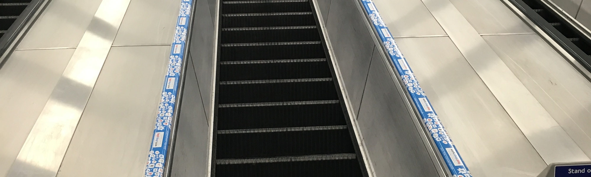 Escalator Handrail Advertising | Orton Lifts & Esclators